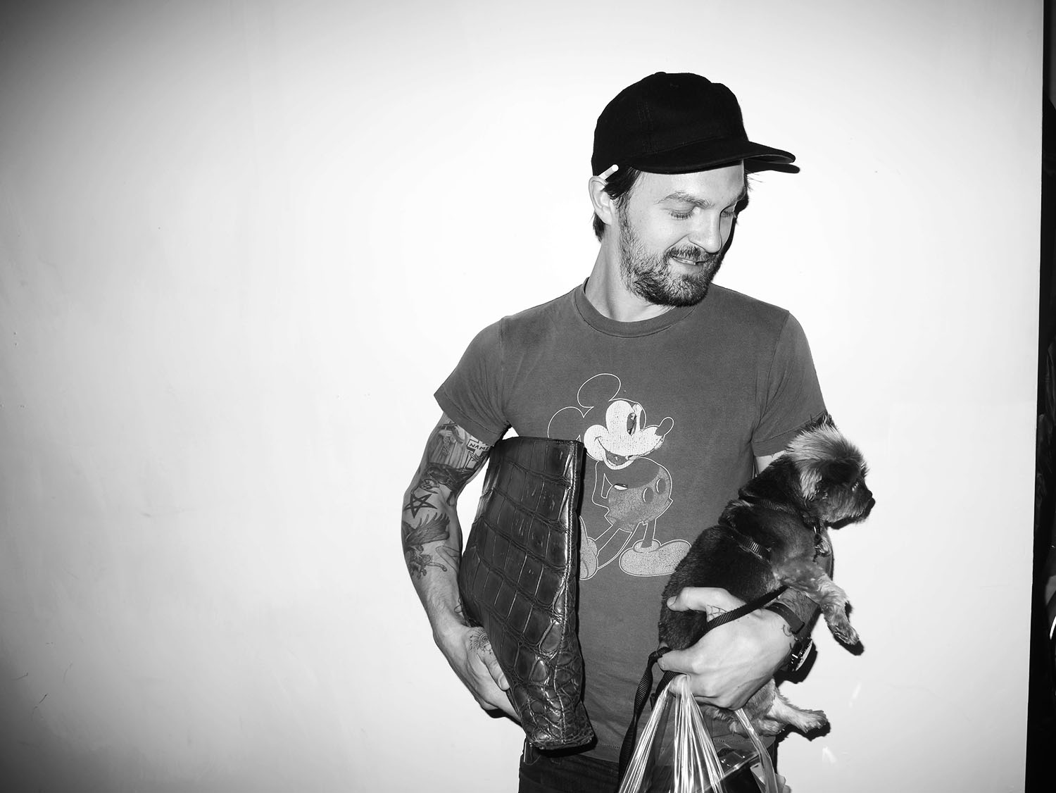 Max Snow and his dog Gidget visiting the Purple Office, New York. Photo ...