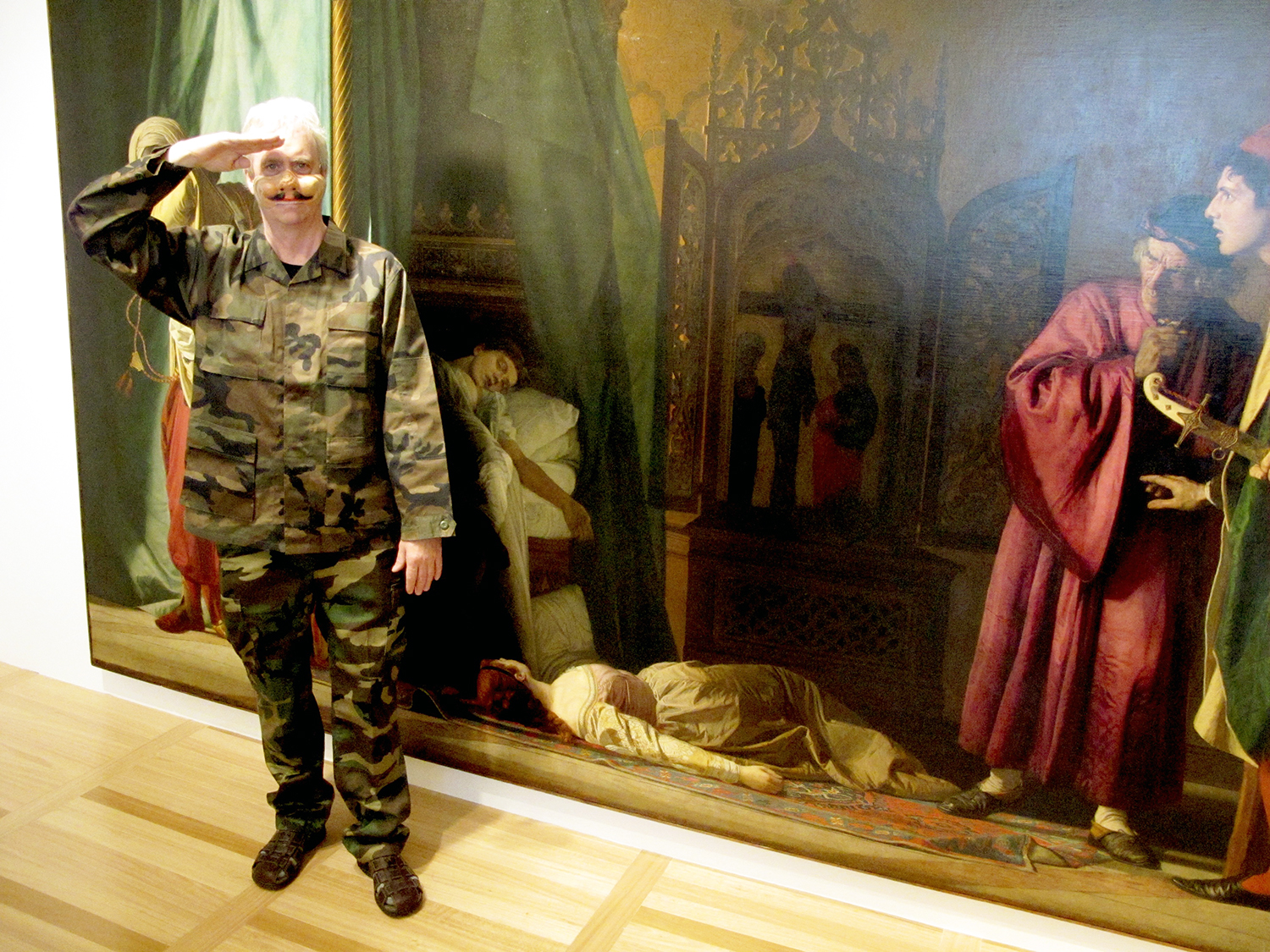 Artist Tony Oursler posing with a mask in front of Pompeo Molmenti’s ...