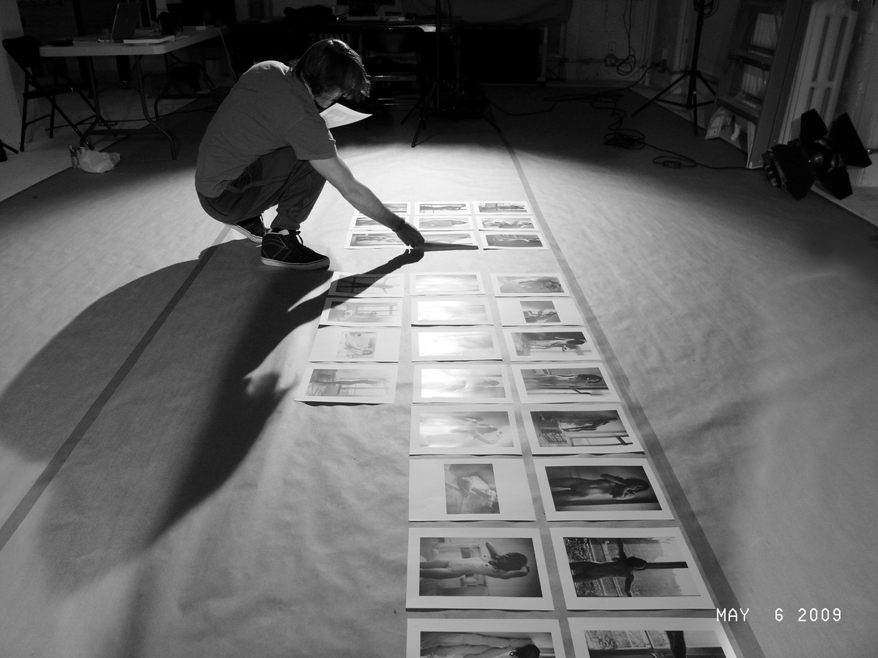Mario Sorrenti in his studio selecting pictures of the shoot which he ...