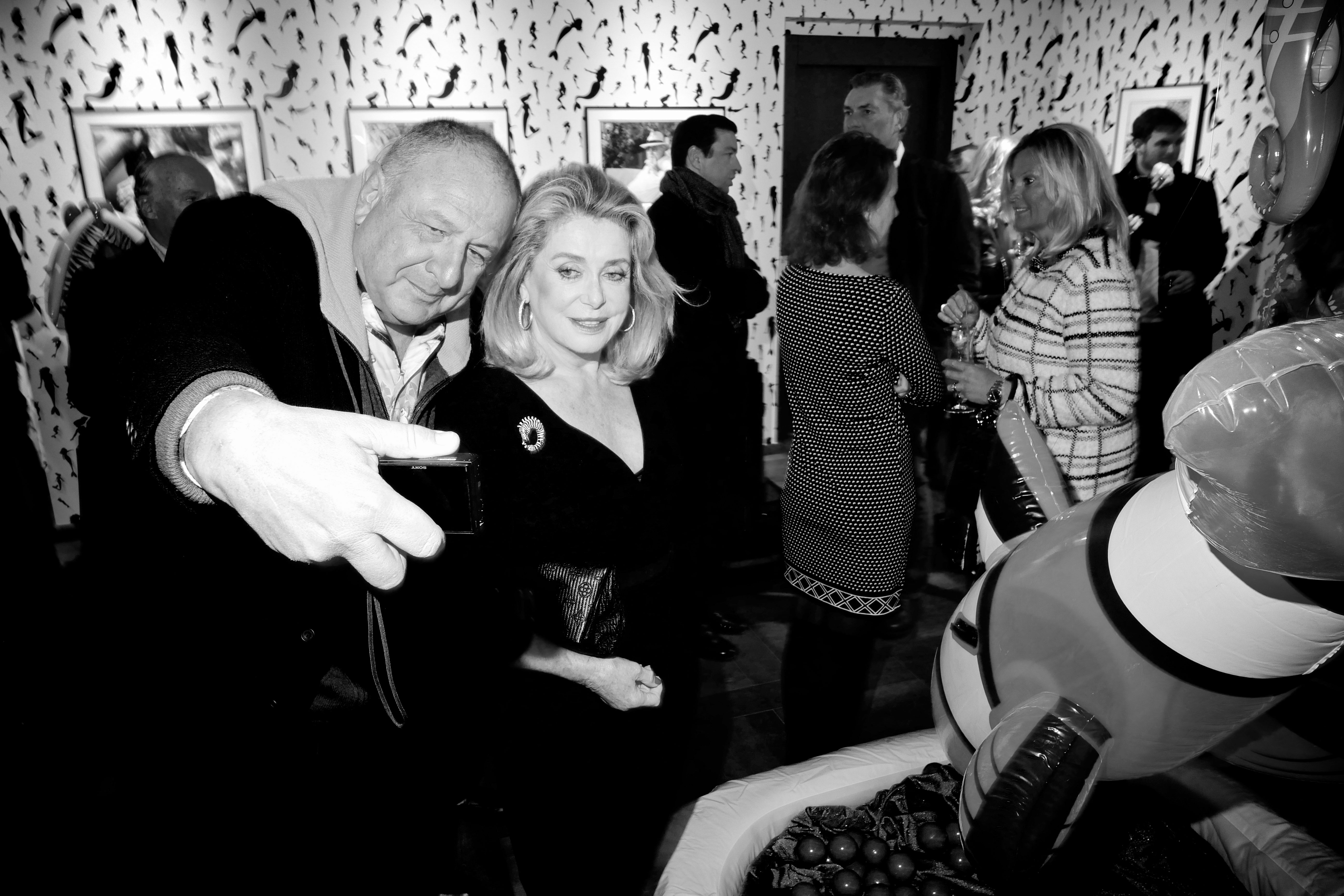Jean Pigozzi and Catherine Deneuve taking a selfie during Jean Pigozzi ...